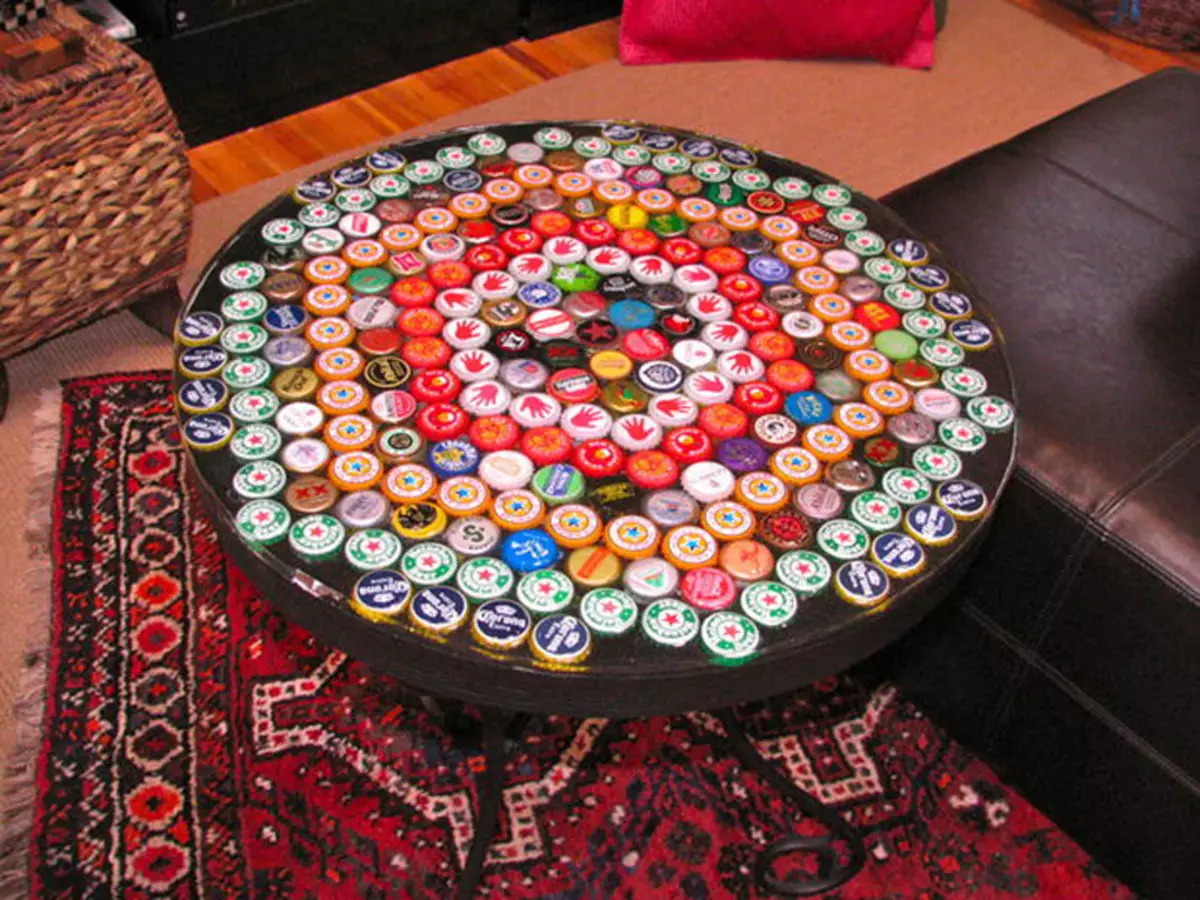 Table of beer covers with their own hands